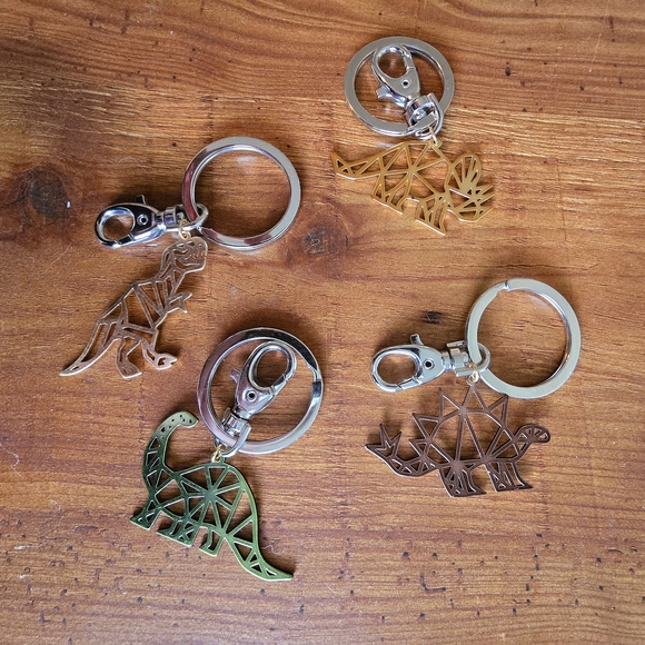 Accessories | Dinosaur Keychain Set In Gold And Silver | Poshmark